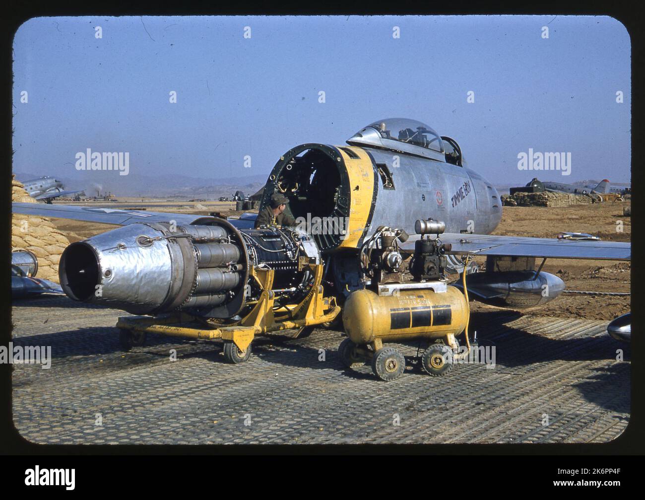 Engine of a North American F-86D Sabre "Jimmy Boy" being inspected. The ...