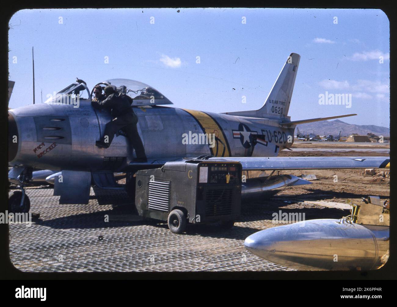 Three-quarter left front view of a North American F-86E Sabre, "Mach ...