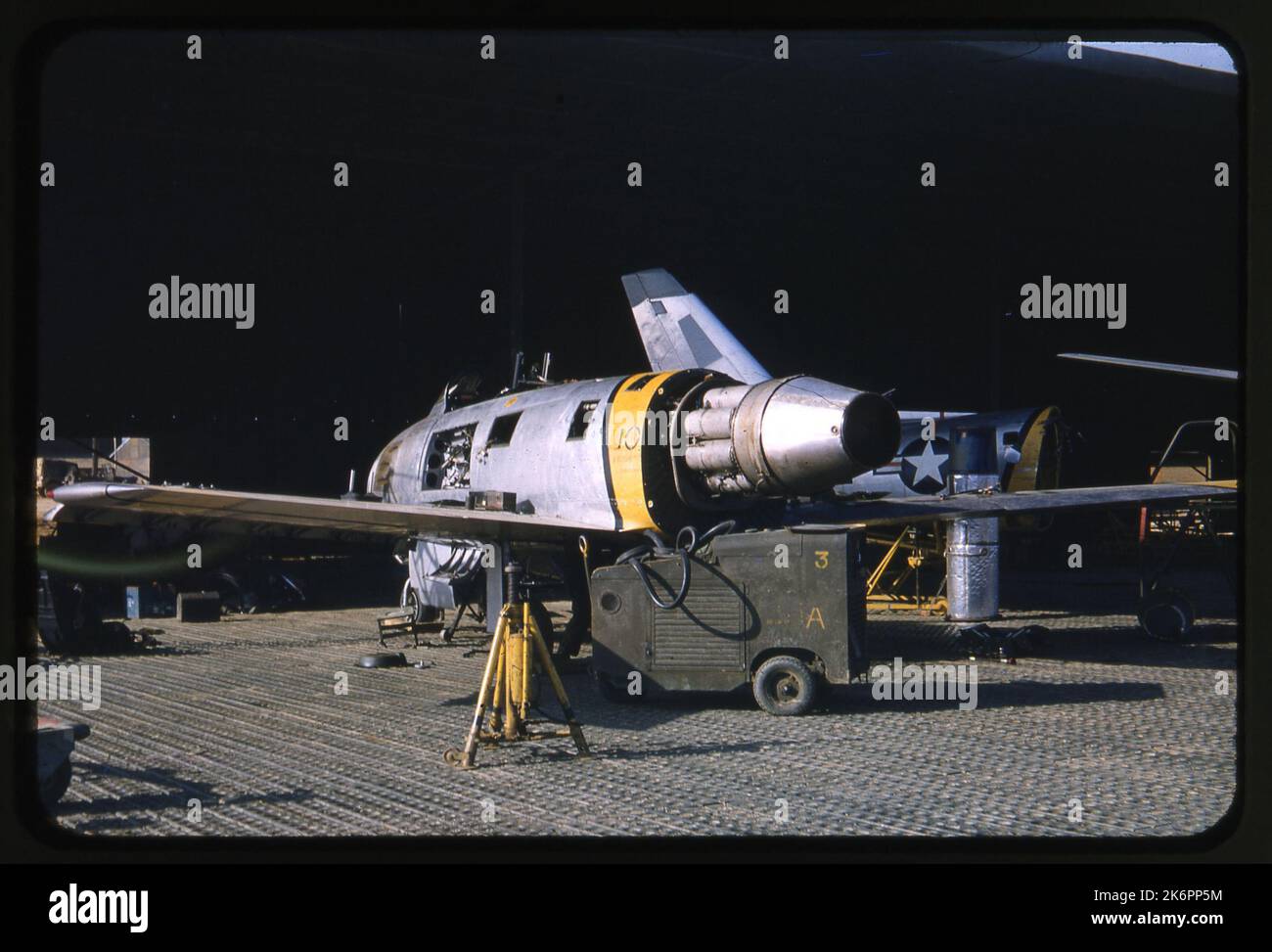 Three-quarter left rear view of a North American F-86 Sabre next to ...