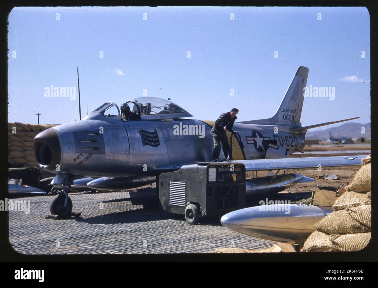 Three-quarter left front view of a North American F-86E Sabre, "Mach ...