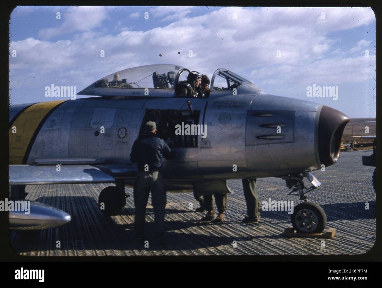 Right side view of a North American F-86 Sabre. Pilot is in cockpit ...