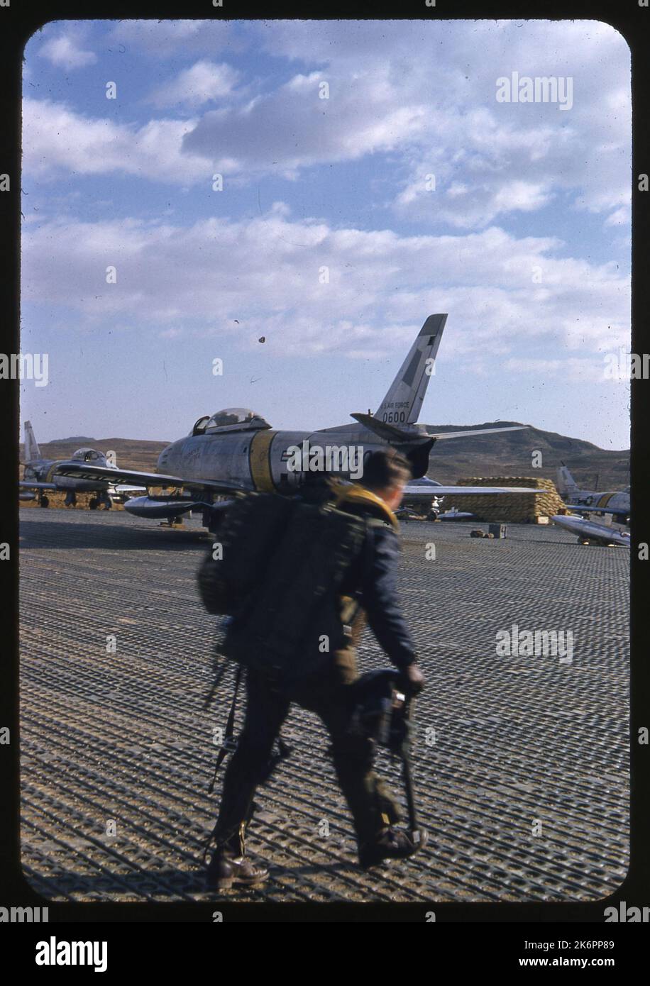 Three-quarter left rear view of a North American F-86 Sabre jet (s/n 50 ...