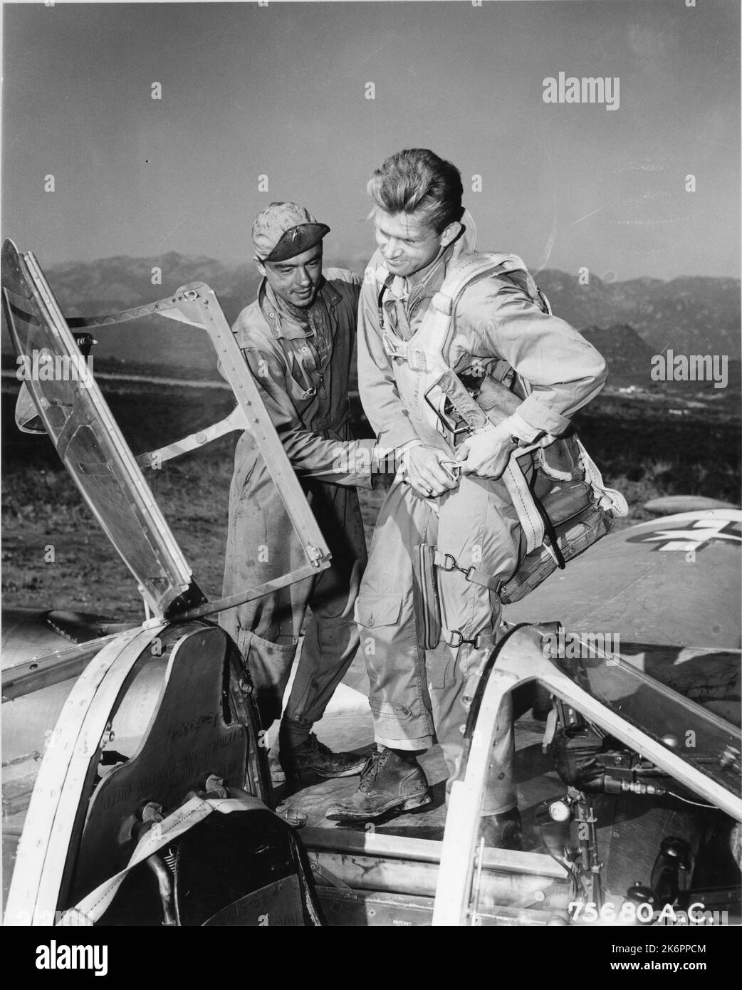 Photograph of Crew Chief Helping His Pilot. Photograph of Crew Chief ...