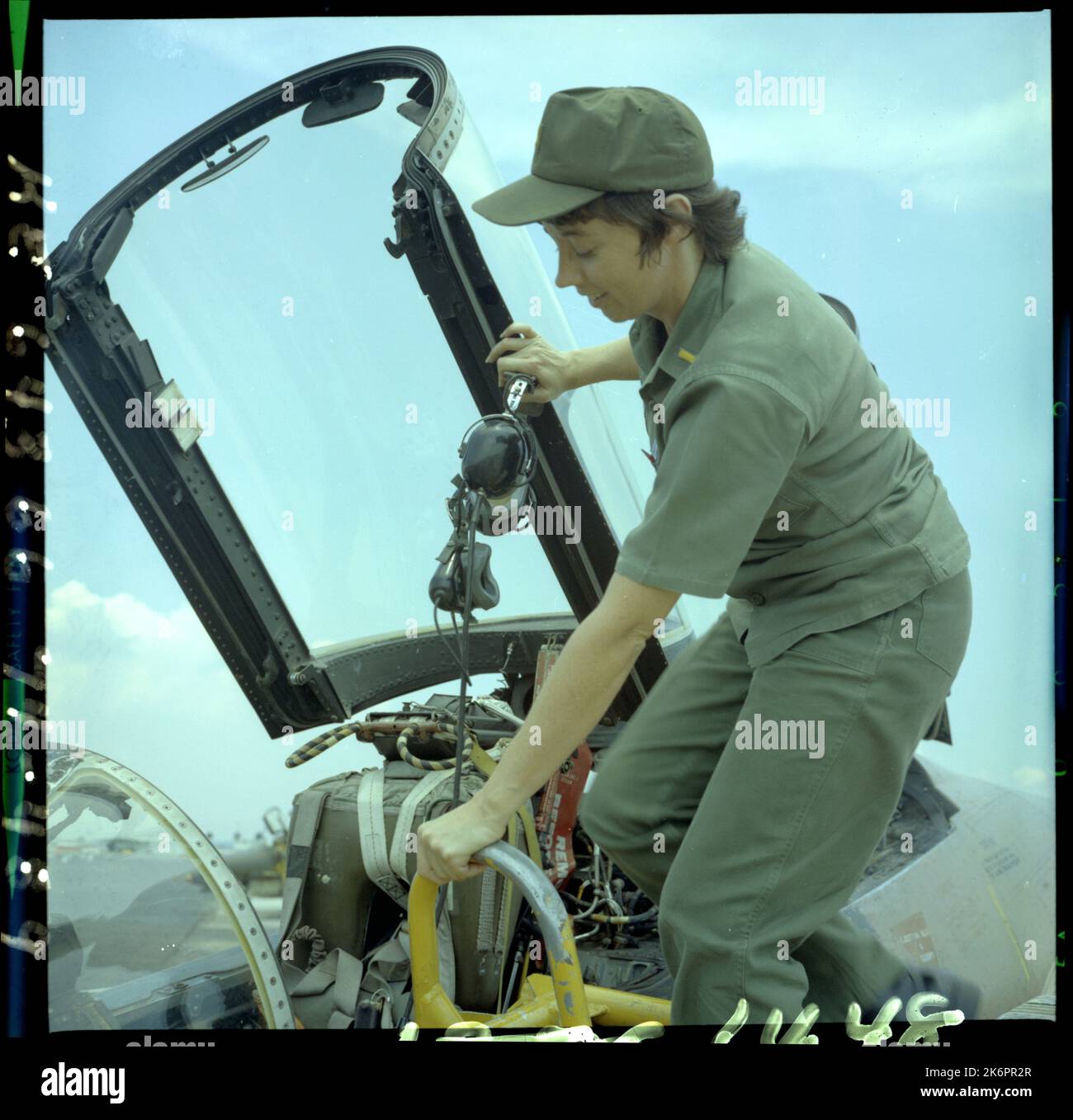 Aircraft Maintenance Officer Climbs Out of the Cockpit After Preflight ...