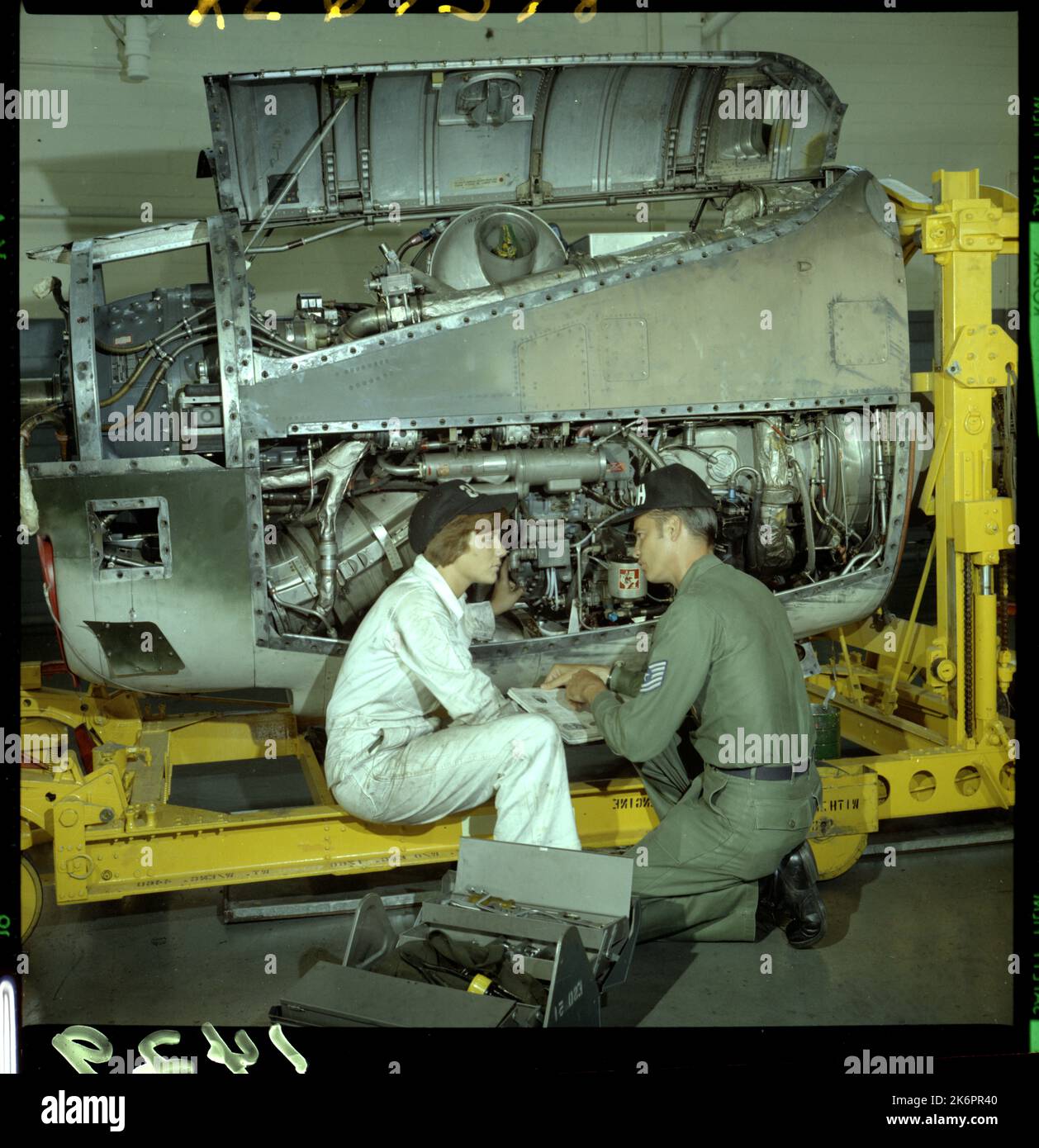 Jet Engine Mechanic Reviews Technical Order Requirements on Jet Engine ...