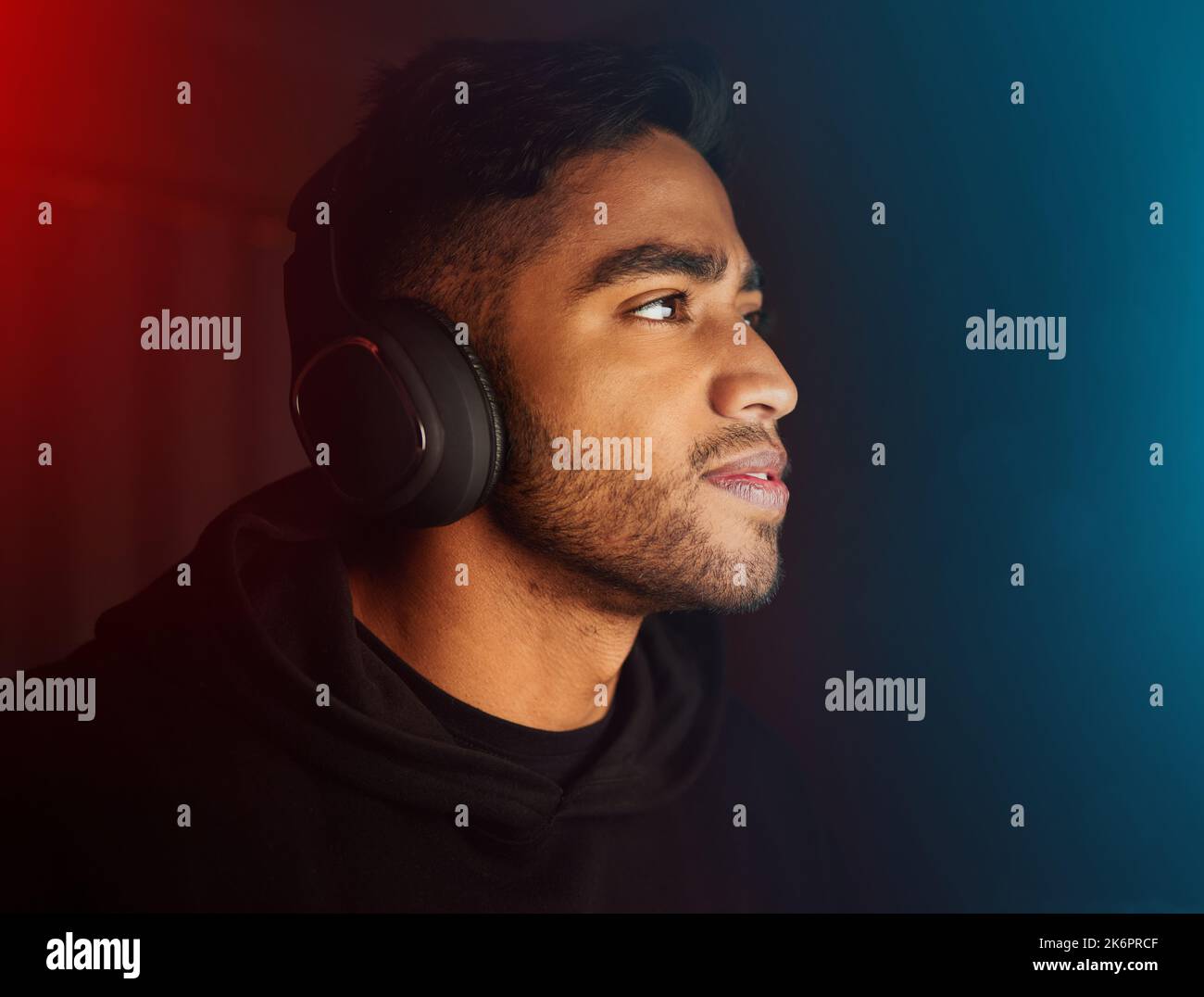 It takes focus to compete at the top. a handsome young male gamer ...