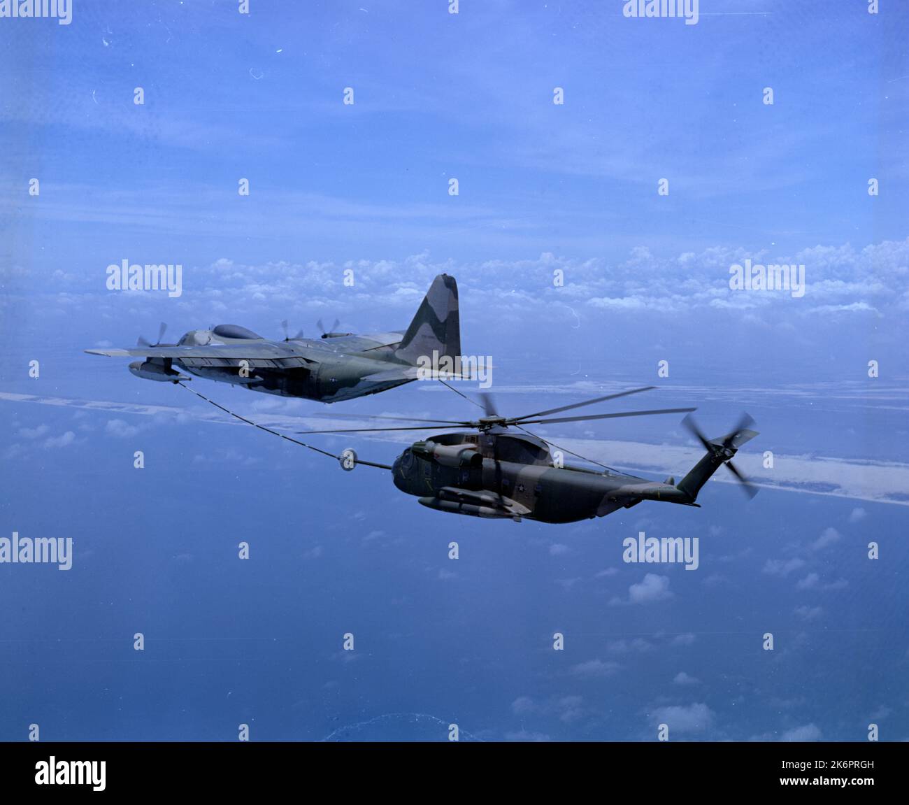 Rear View of HH-53B Refueled in Flight by HC-130P. Rear View of HH-53B ...