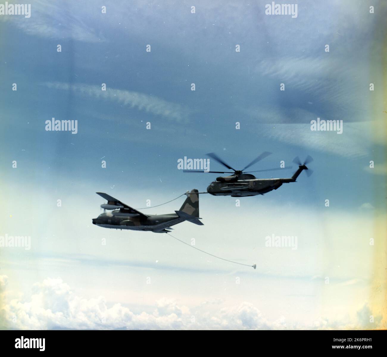 Low Angle Rear View of HC-130P Refueling an HH-53. Low Angle Rear View ...