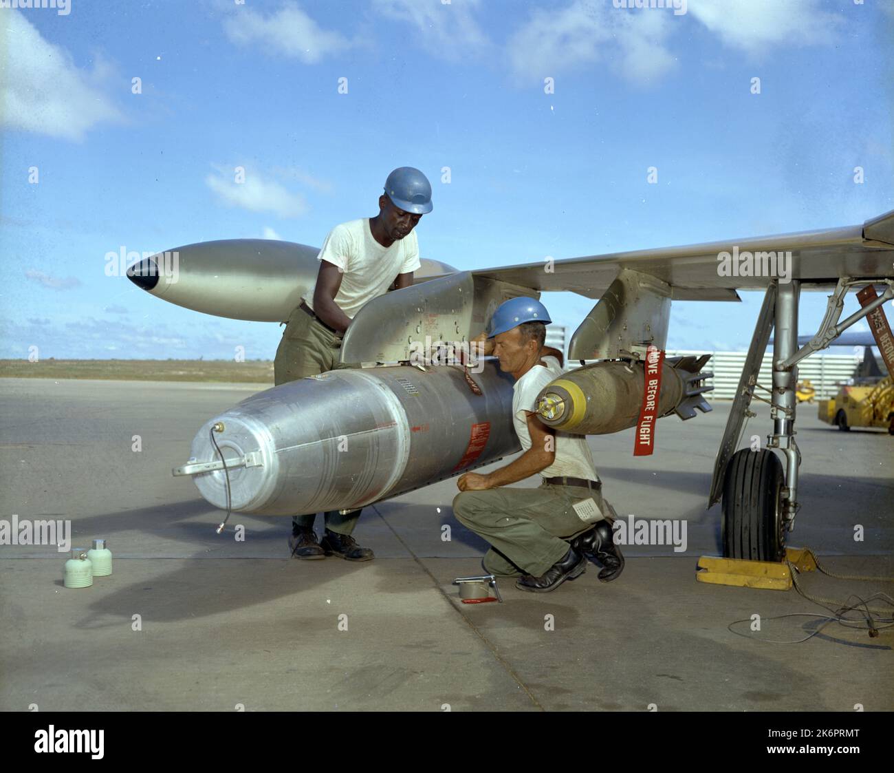 Air Force Munitions Specialists Hand Bombs Under the Wing of an ...