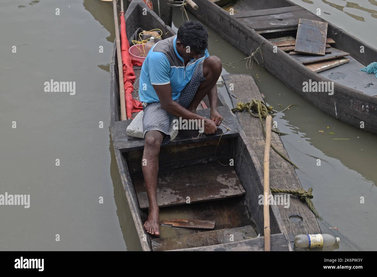 Man working to restore his boat hi-res stock photography and images - Alamy