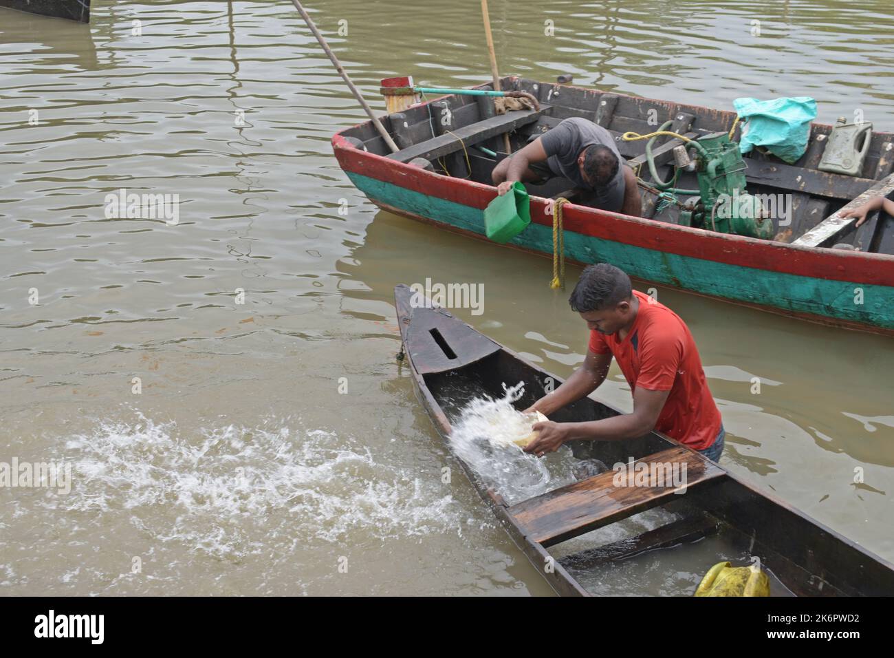 fisherman working on boat Stock Photo - Alamy