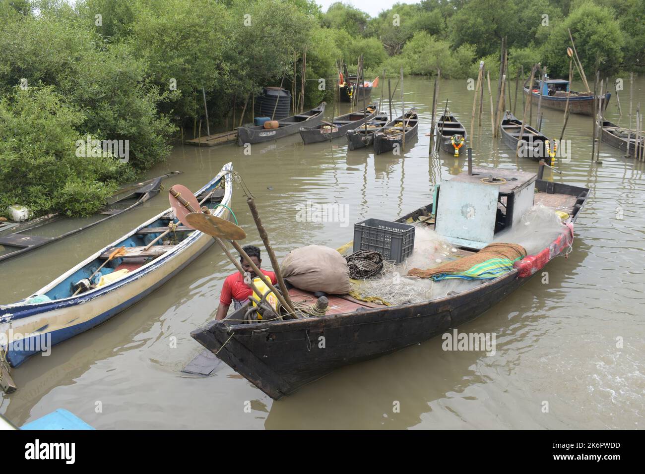 fisherman working on boat Stock Photo - Alamy