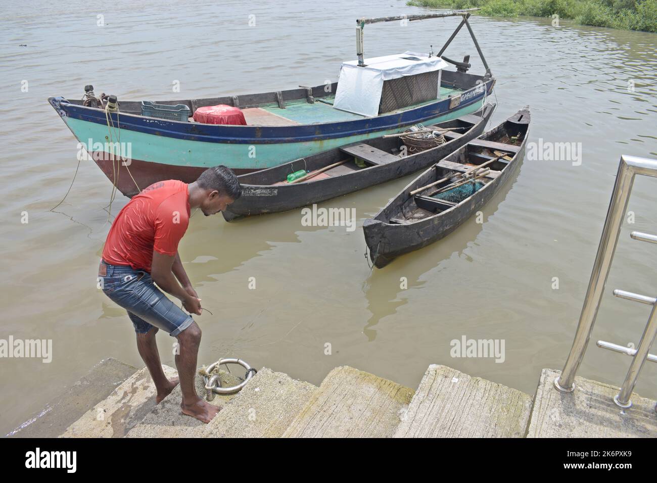 fisherman working on boat Stock Photo - Alamy