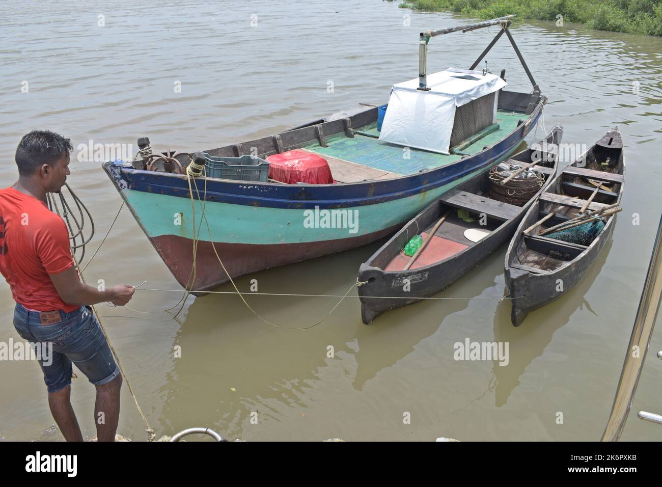fisherman working on boat Stock Photo - Alamy