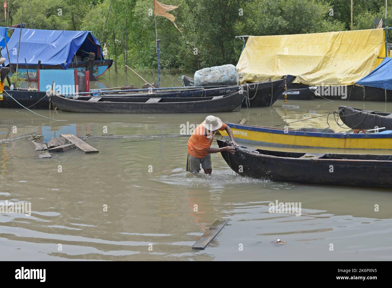 Man working to restore his boat hi-res stock photography and images - Alamy
