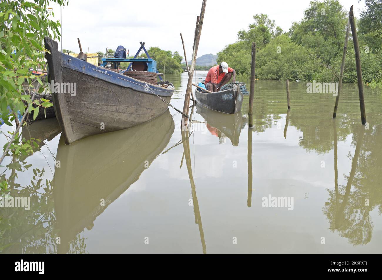 fisherman working on boat Stock Photo - Alamy