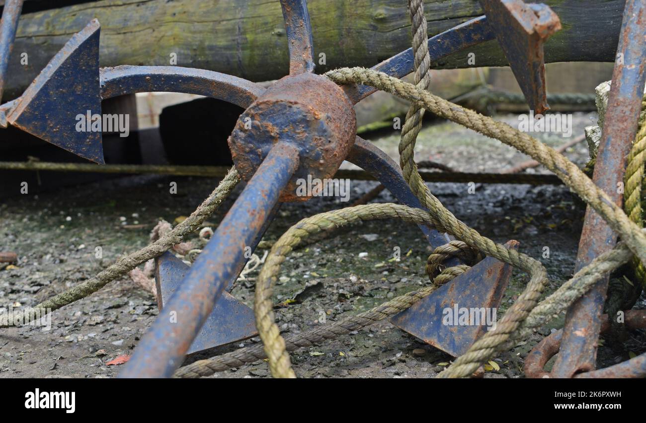 Rusty Anchors and Maritime Equipment on a Wooden Dock at Daytime Stock ...