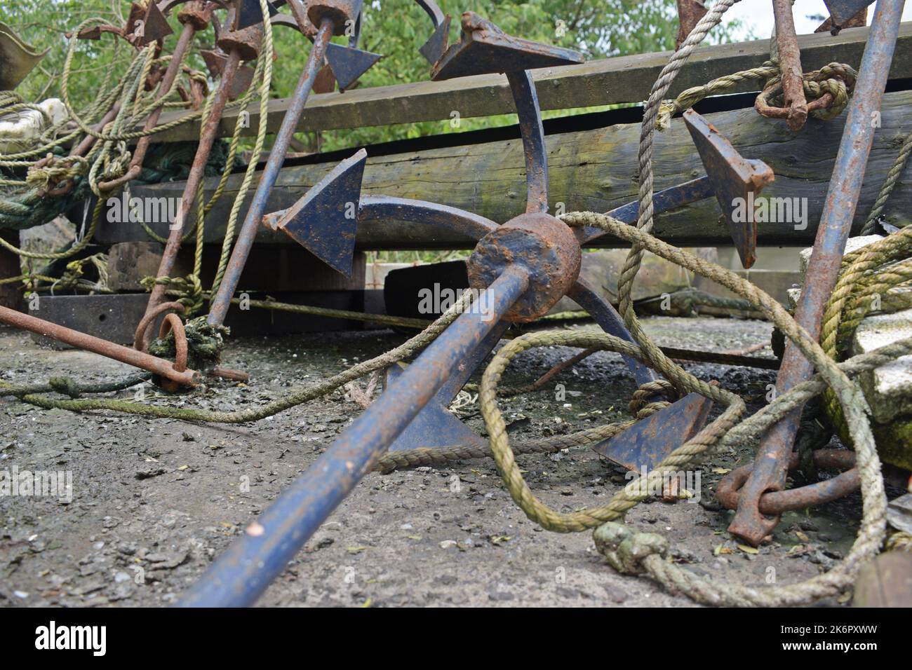 Rusty Anchors and Maritime Equipment on a Wooden Dock at Daytime Stock ...