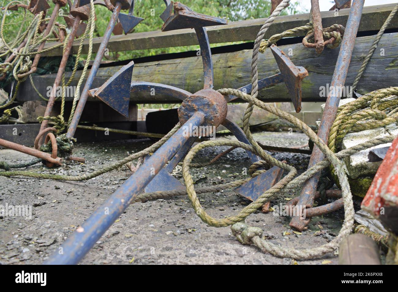 Rusty Anchors and Maritime Equipment on a Wooden Dock at Daytime Stock ...