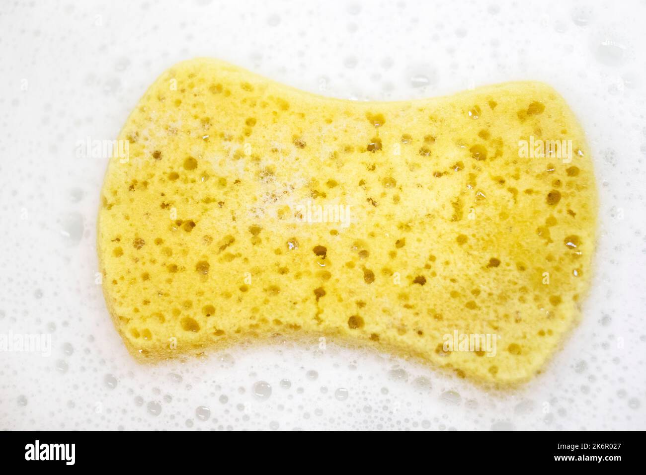 Close up of blue sponge and rag in kitchen sink full of foam Stock ...