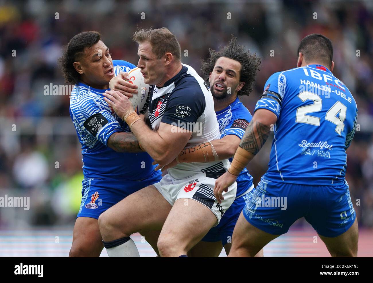 England's Thomas Burgess is tackled by Samoa's Josh Papali'i and Josh ...