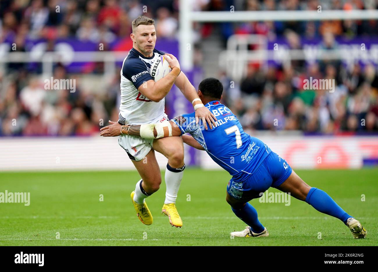 England's George Williams is tackled by Samoa's Anthony Milford during ...