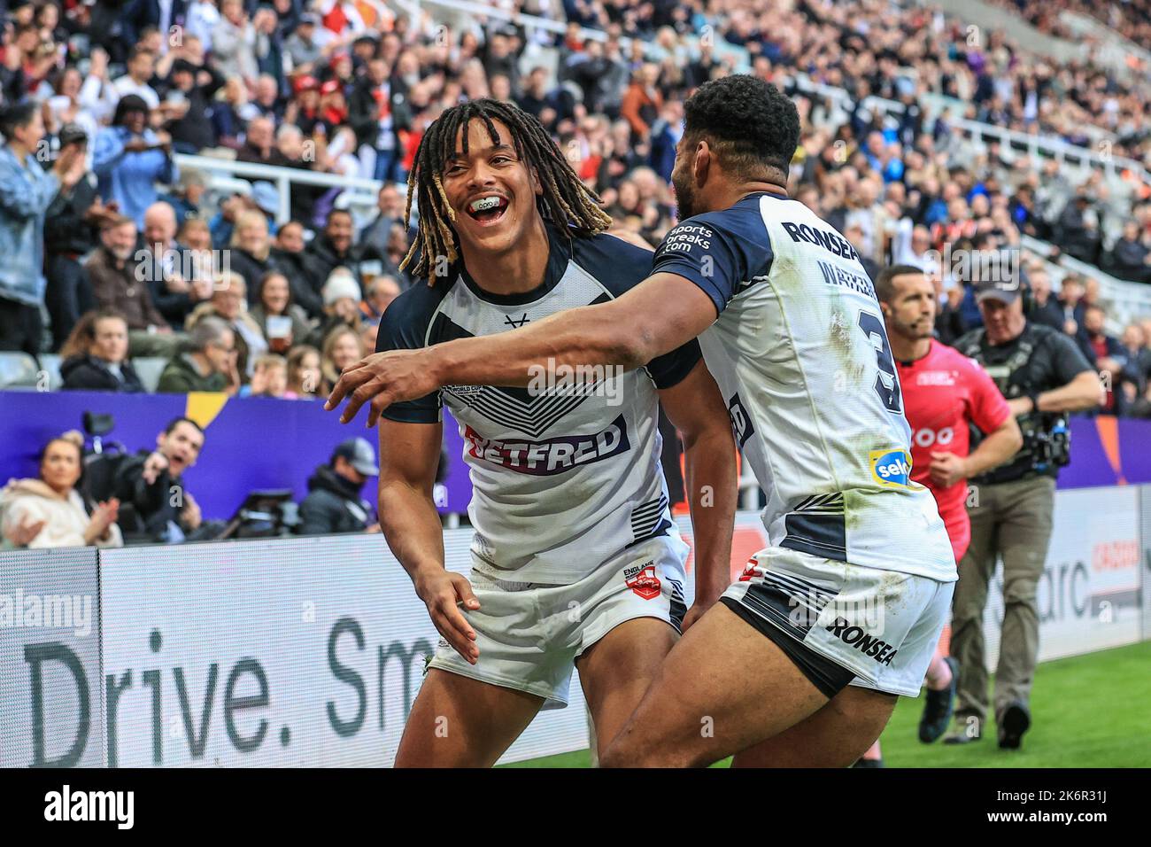 Dom Young of England celebrates his try with Kallum Watkins of England ...