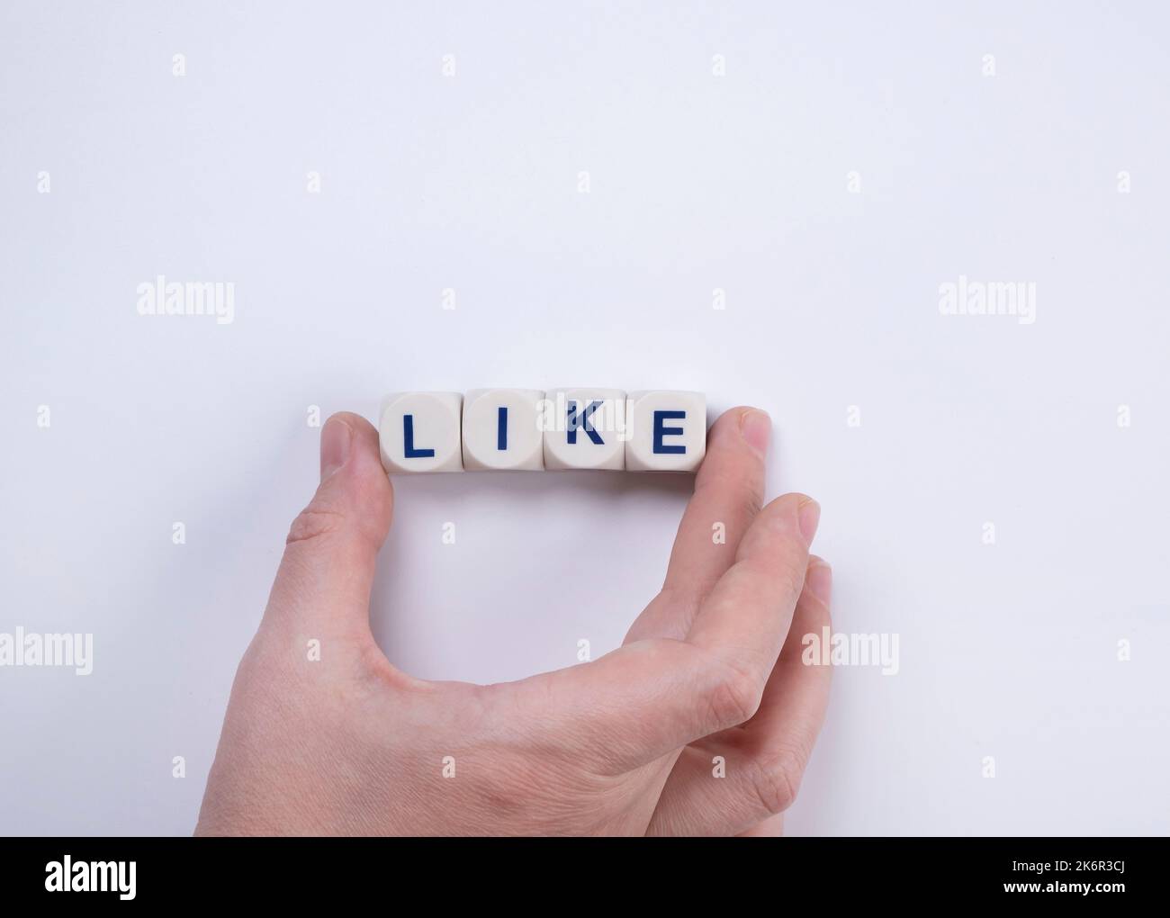 female hand lays text like from cubes with letters on a white ...