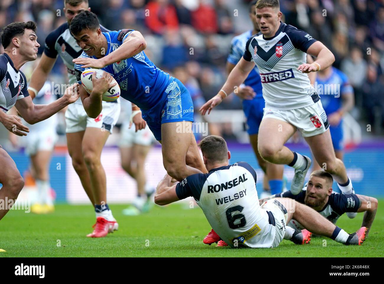 Samoa's Joseph Suaali'i is tackled by England's Jack Welsby during the ...