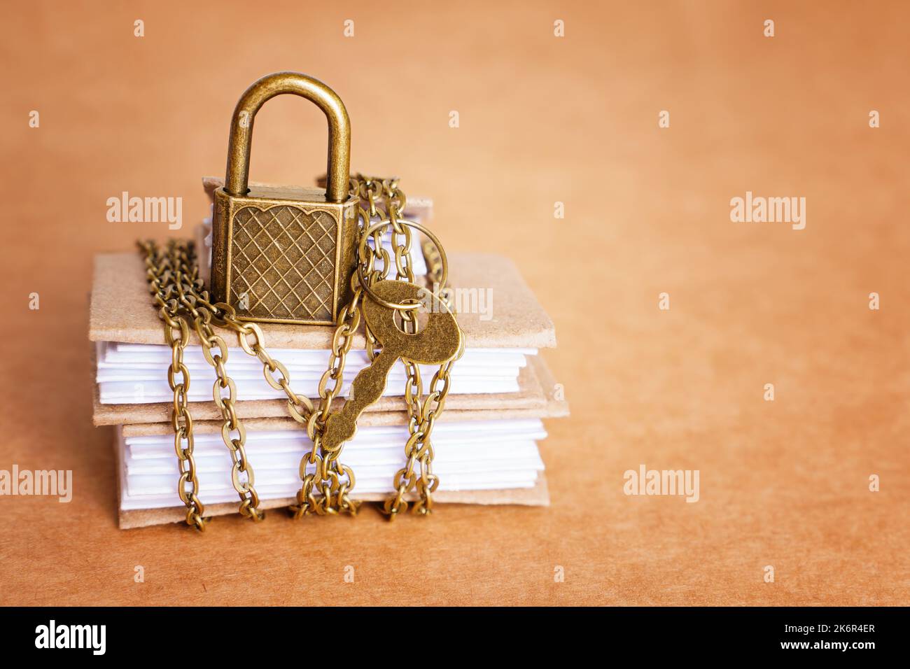 Small accounting books secured with chain and keyed padlock. Outsourced ...