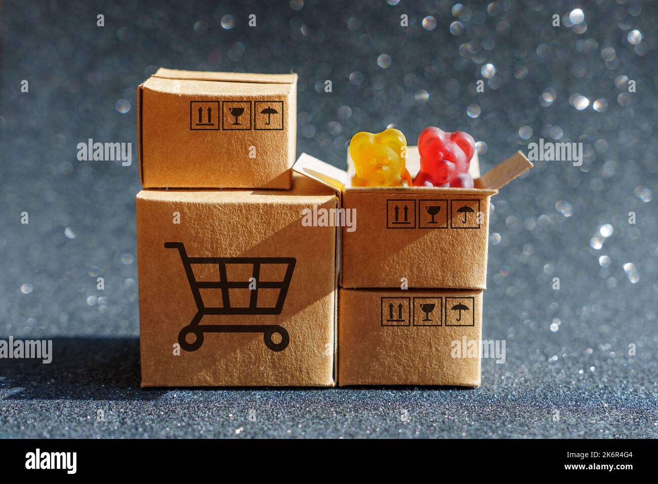 Miniature cardboard boxes with shipping labels isolated on black ...
