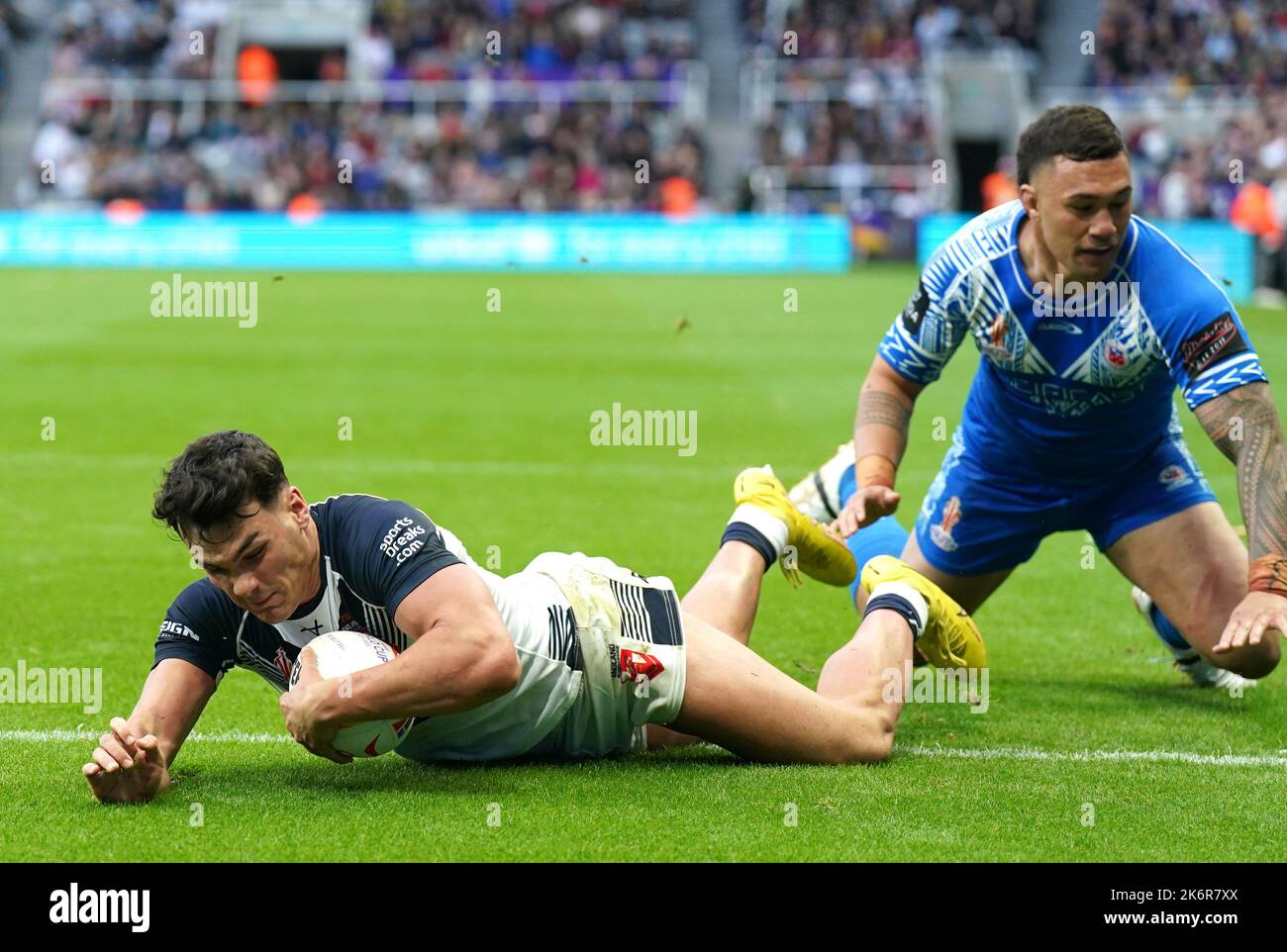 England's Herbie Farnworth dives in to score his sides fifth try during the Rugby League World ...