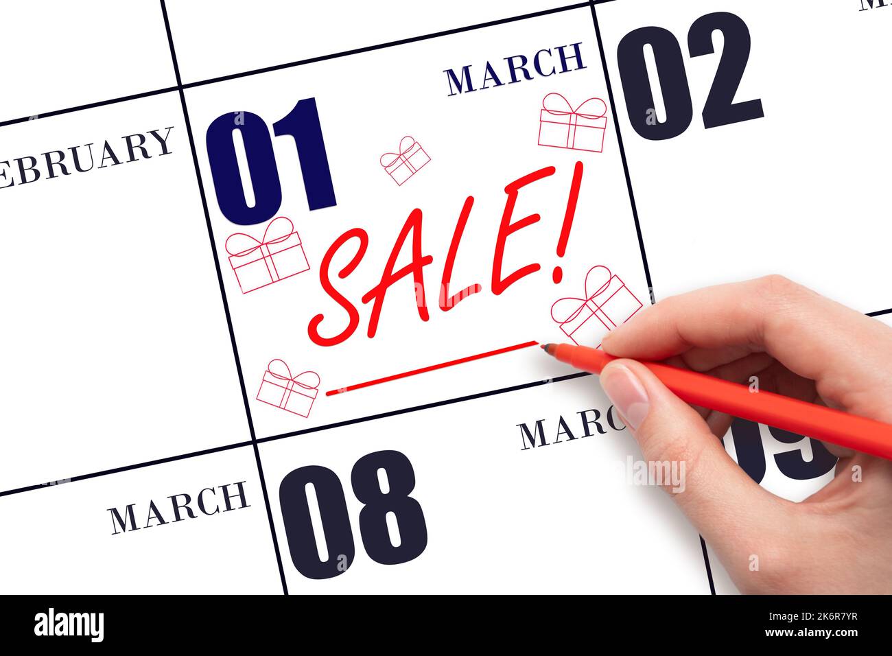 1st day of March. Hand writing text SALE and drawing gift boxes on ...