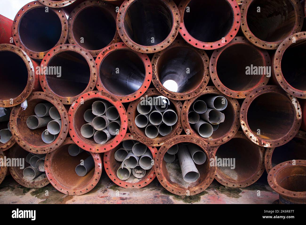 A texture industrial background of Rusty iron pipes stack Stock Photo ...