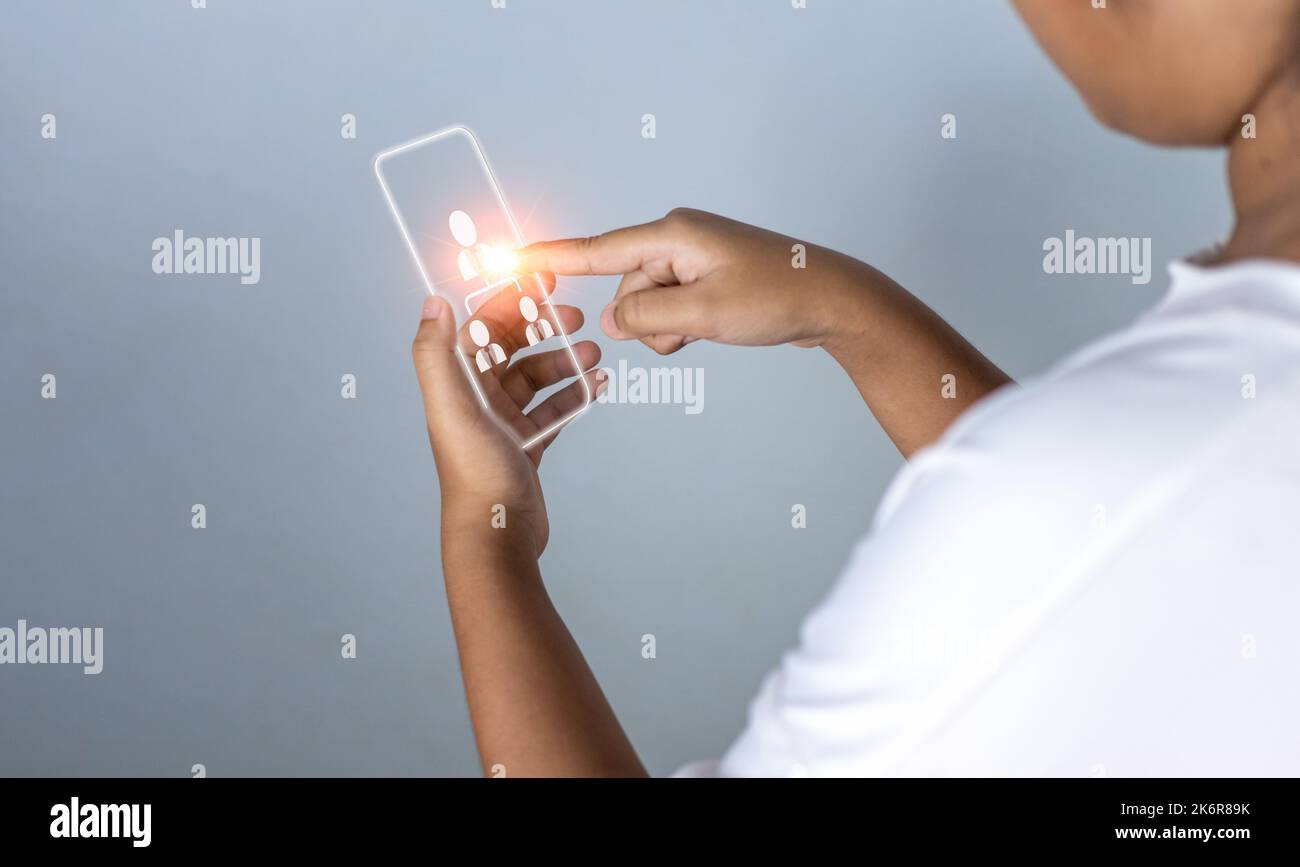 The phone is placed on the lid of the person hand. Communication ...