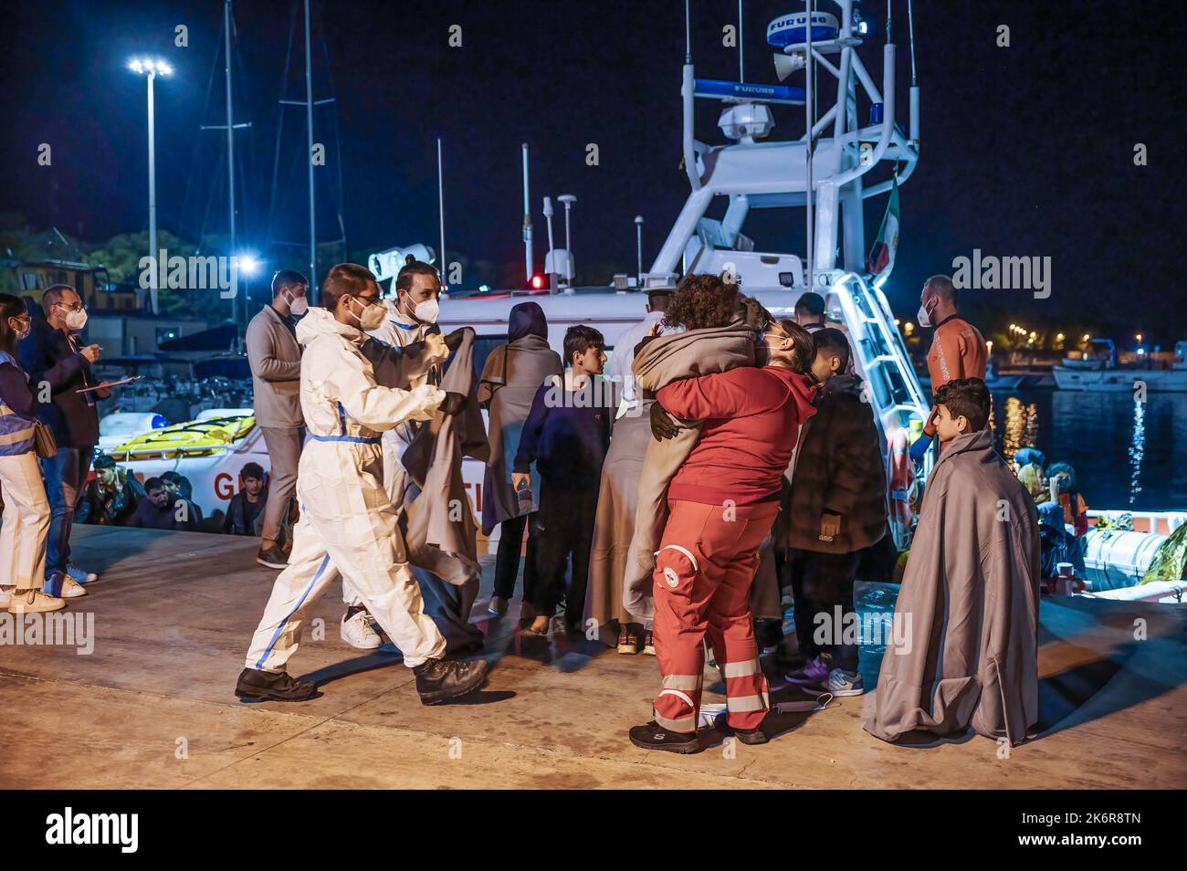 Roccella Jonica, Italy. 14th Oct, 2022. Members of the Red Cross assist ...