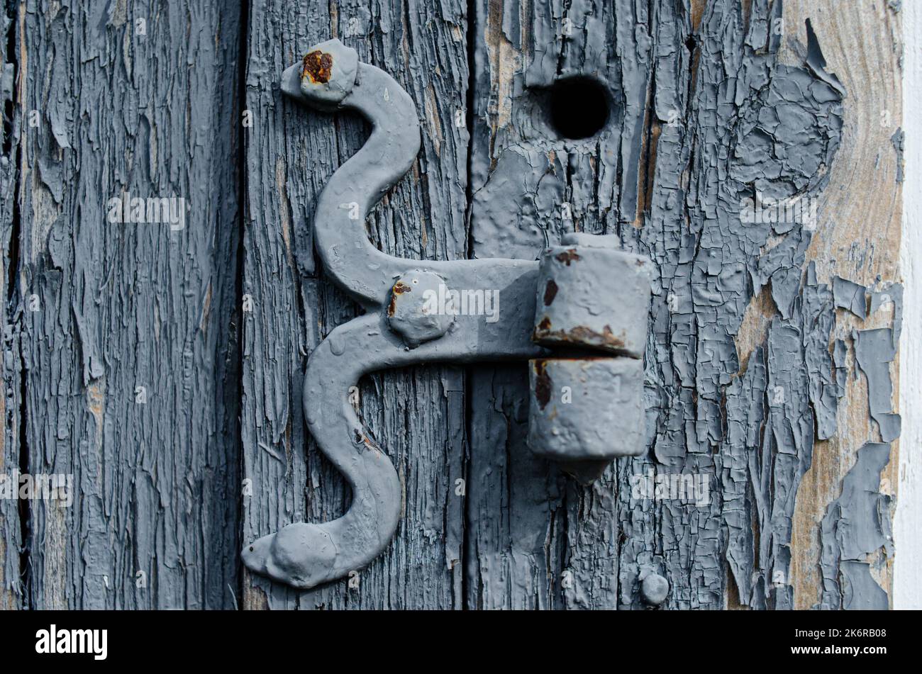 Rural wooden door with a metal hook minimalism, color, geometry, lines ...
