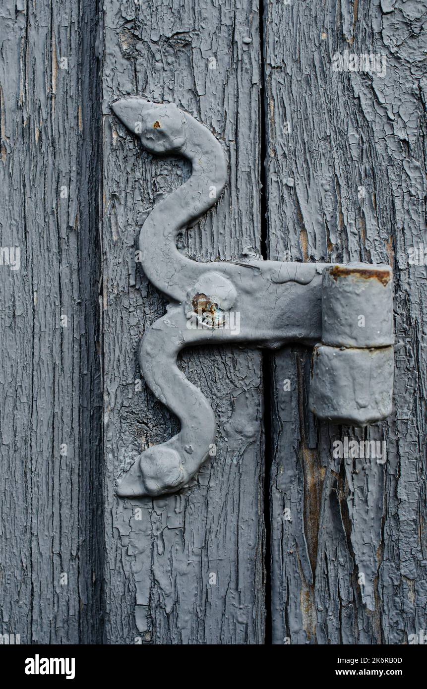 Rural wooden door with a metal hook minimalism, color, geometry, lines ...