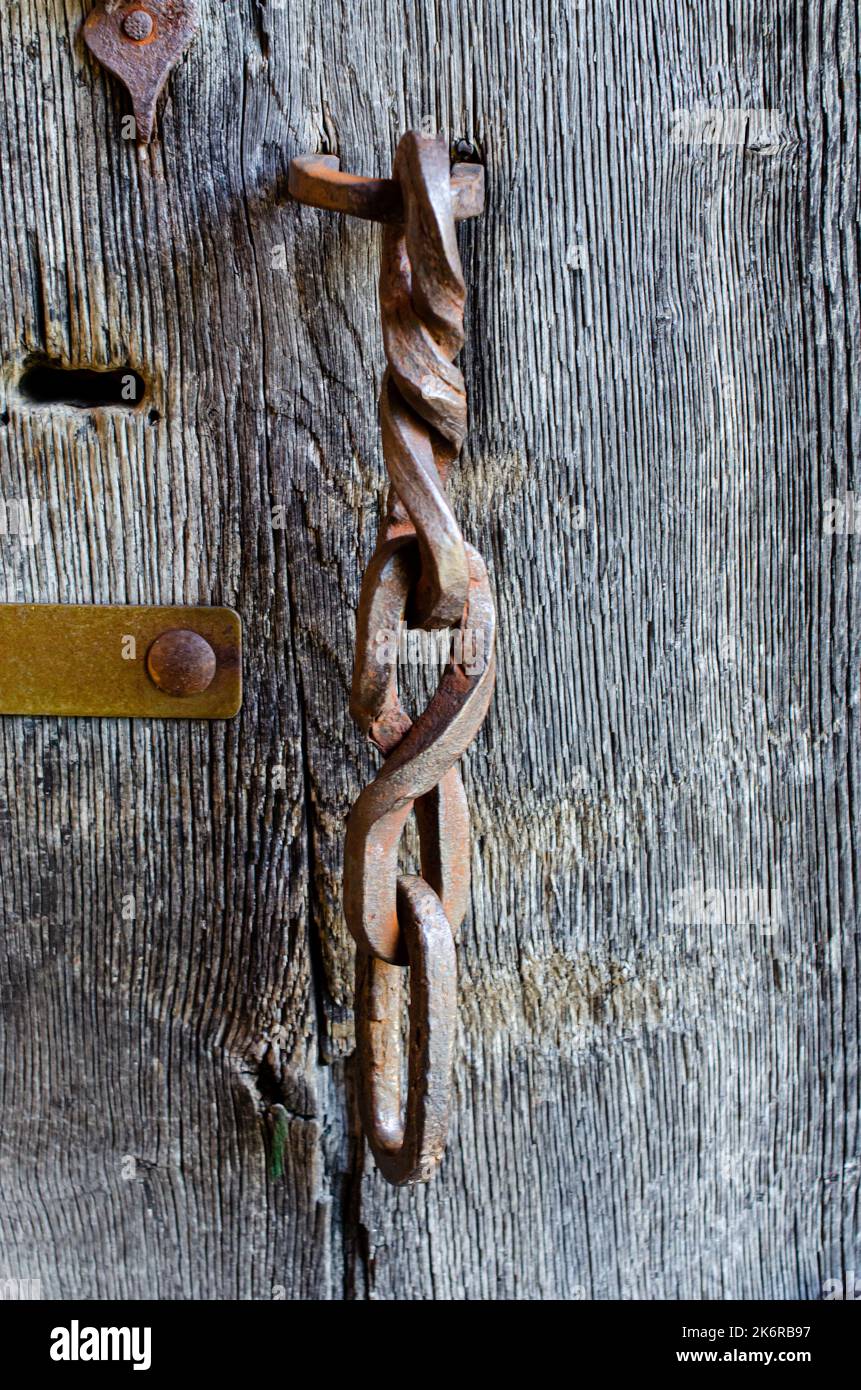 Rural wooden door with a metal hook minimalism, color, geometry, lines ...