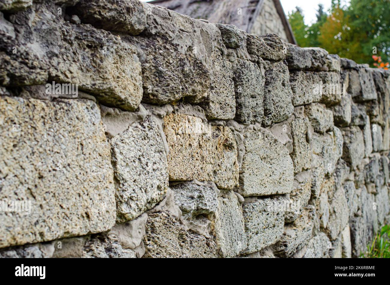 Dun Ardtrek broch Panning shot across large boulder, stone build wall ...