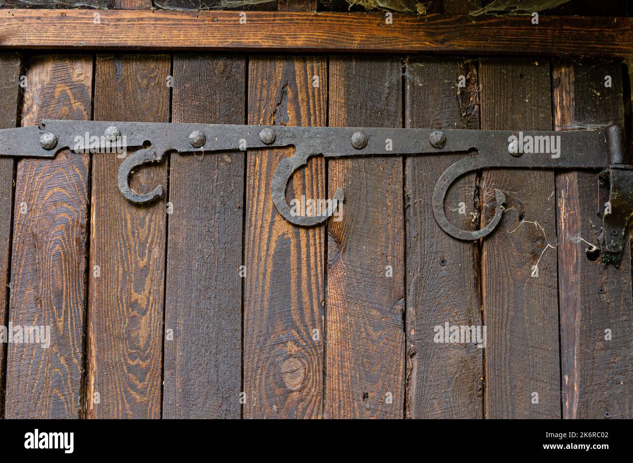 Rural wooden door with a metal hook minimalism, color, geometry, lines ...