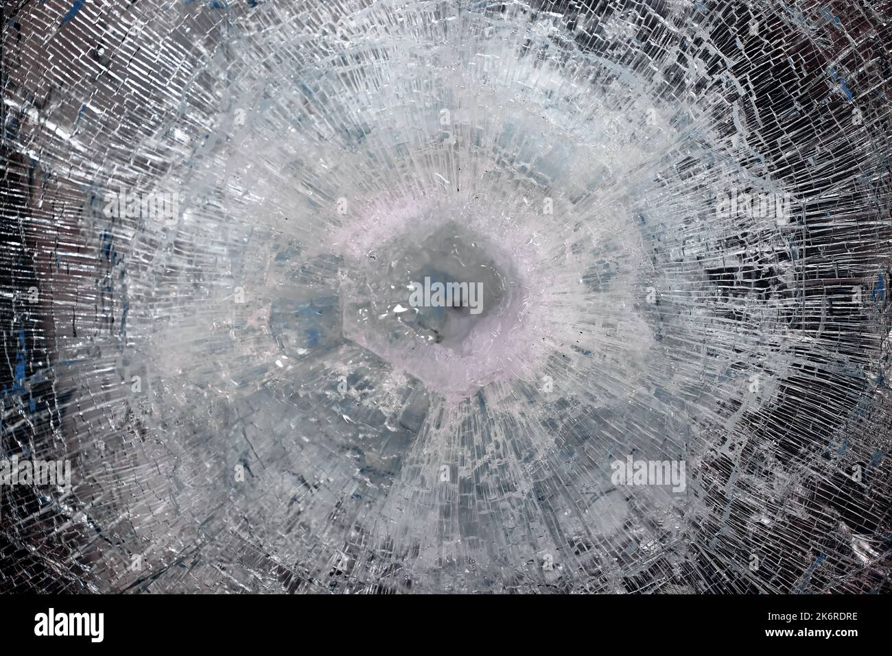 Bulletproof glass after test. bulletproof glass with cracks and a ...