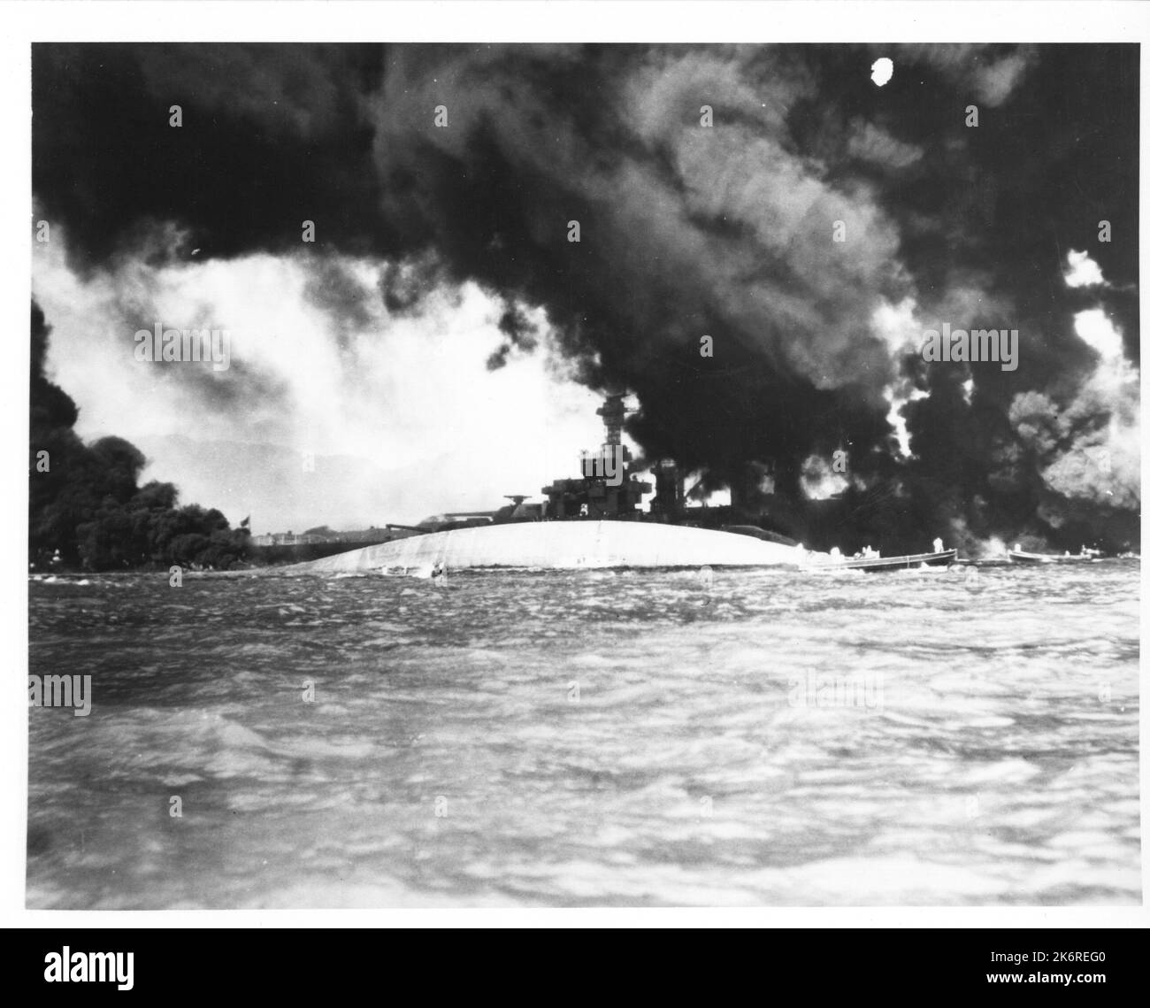 Photograph of the Capsized USS Oklahoma and the USS Maryland after the ...