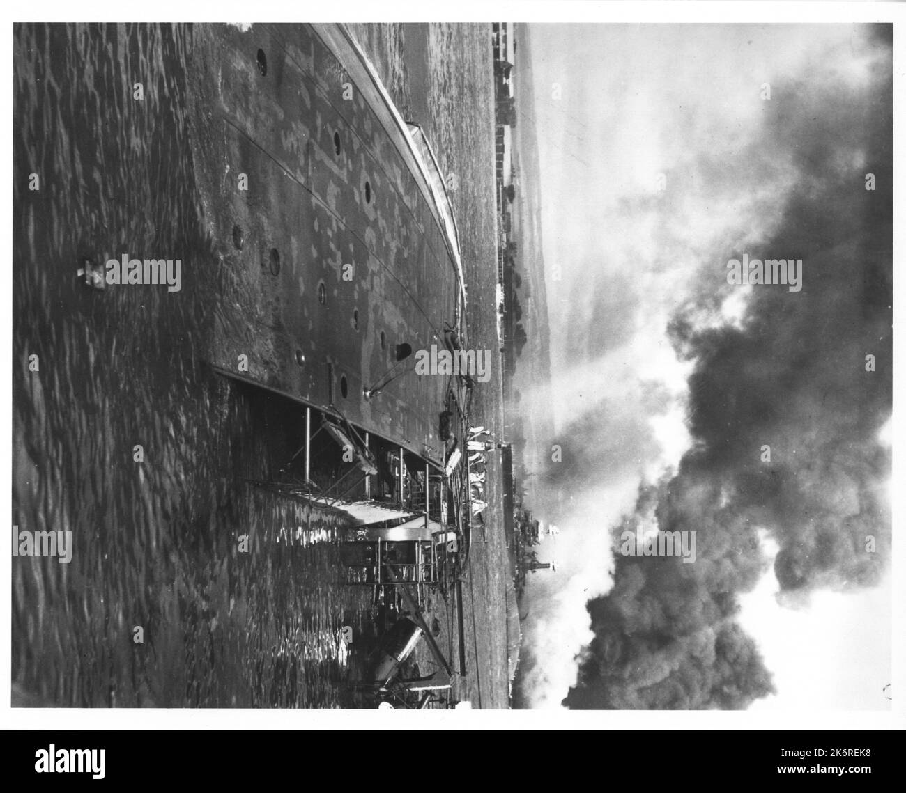 Photograph of the USS Oglala Capsized and Sinking after the Japanese ...
