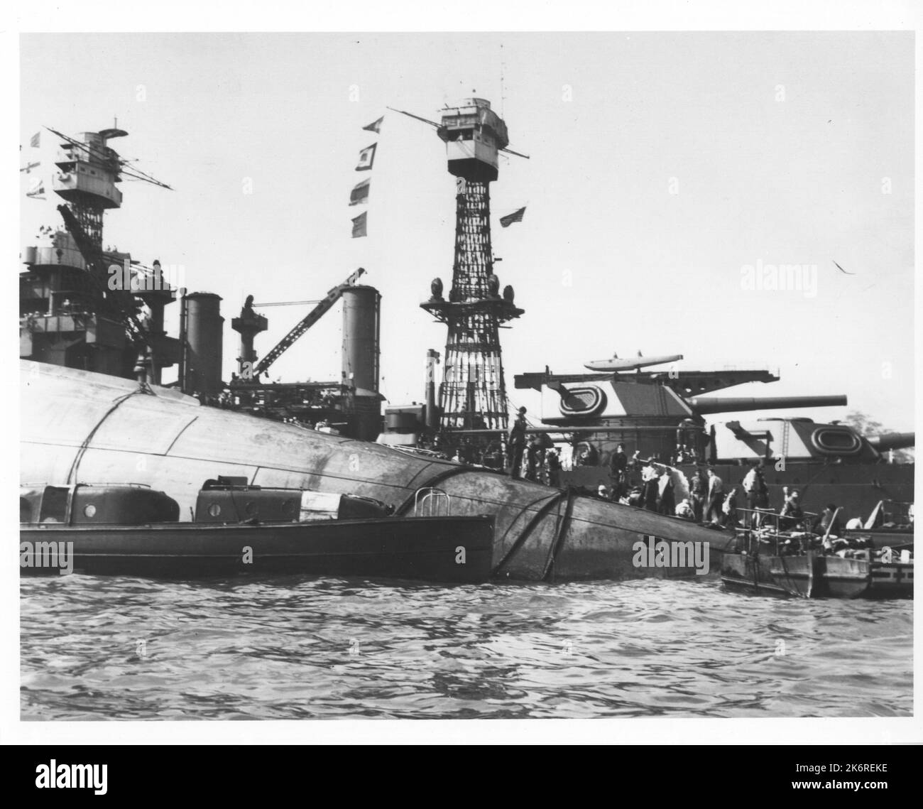 Photograph of the Capsized USS Oklahoma and the USS Maryland after the ...