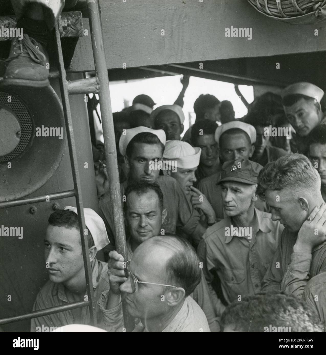 Photograph of Ernie Pyle and Sailors Listening to War Reports Over a ...