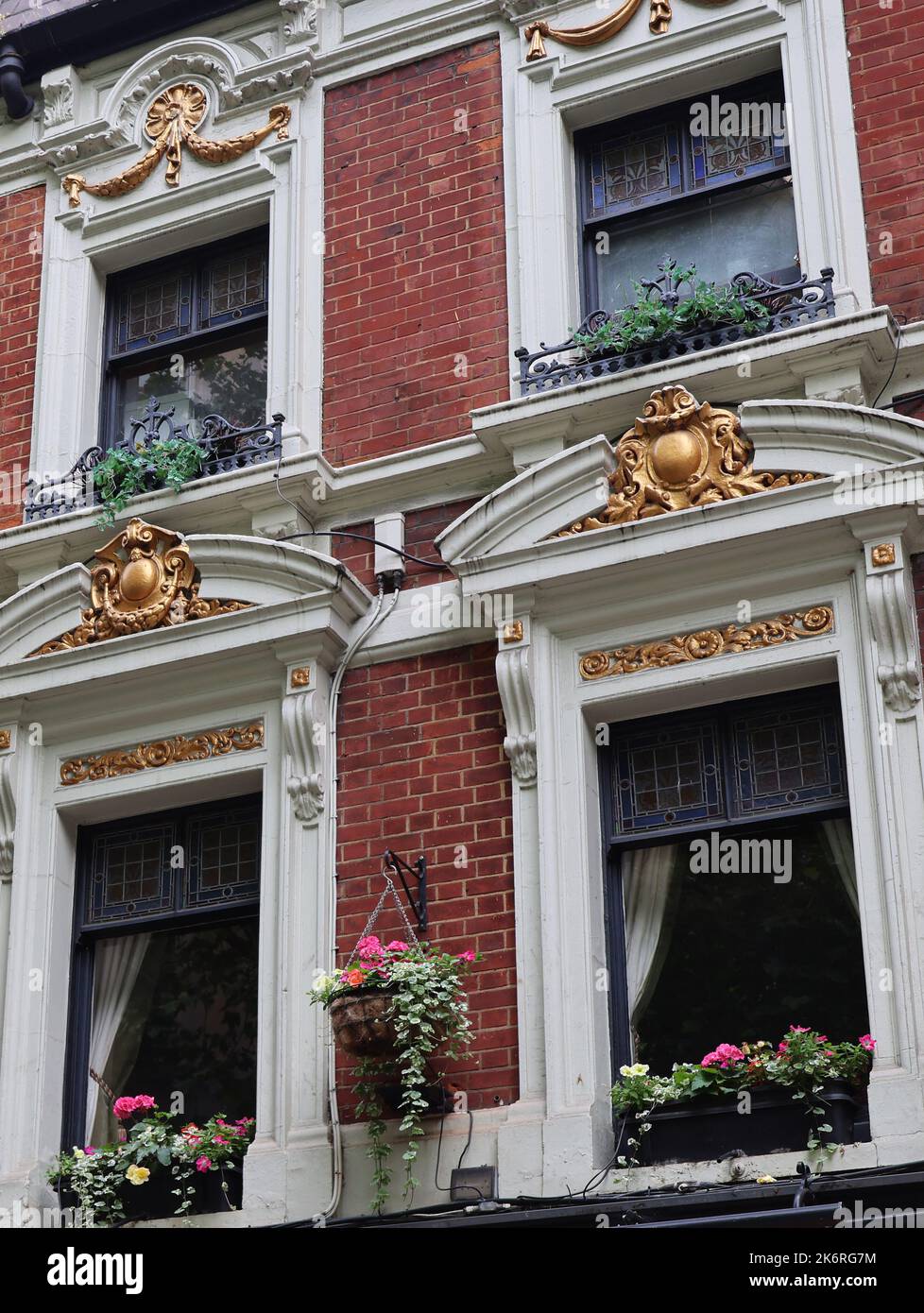 Characteristic architecture of windows of a London building Stock Photo ...