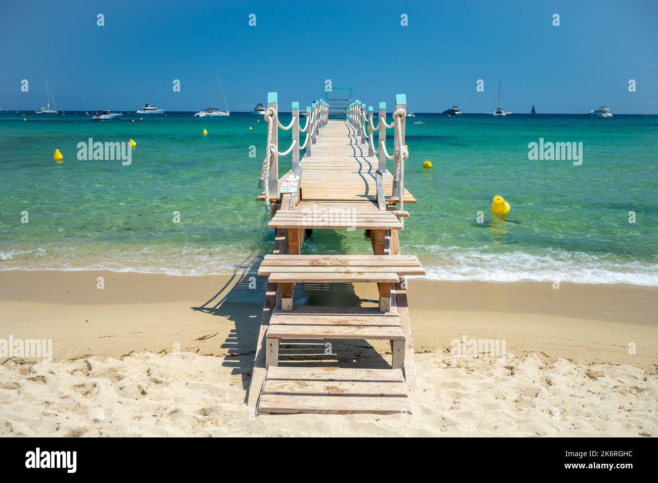 Wooden pier for guests of yachts on legendary Pampelonne beach near ...