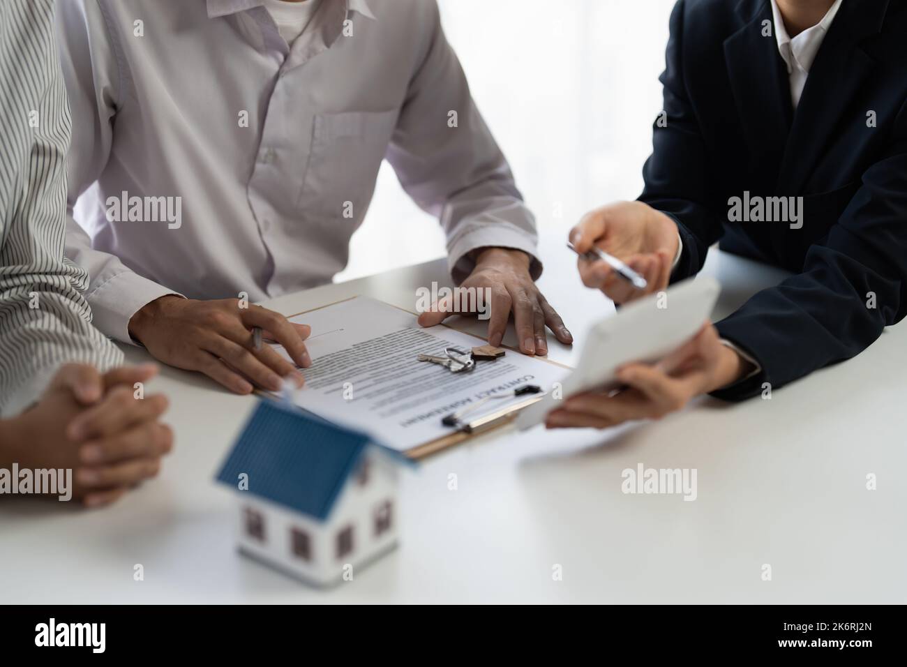 Real Estate Agent explain insurance and agreement contract to client ...