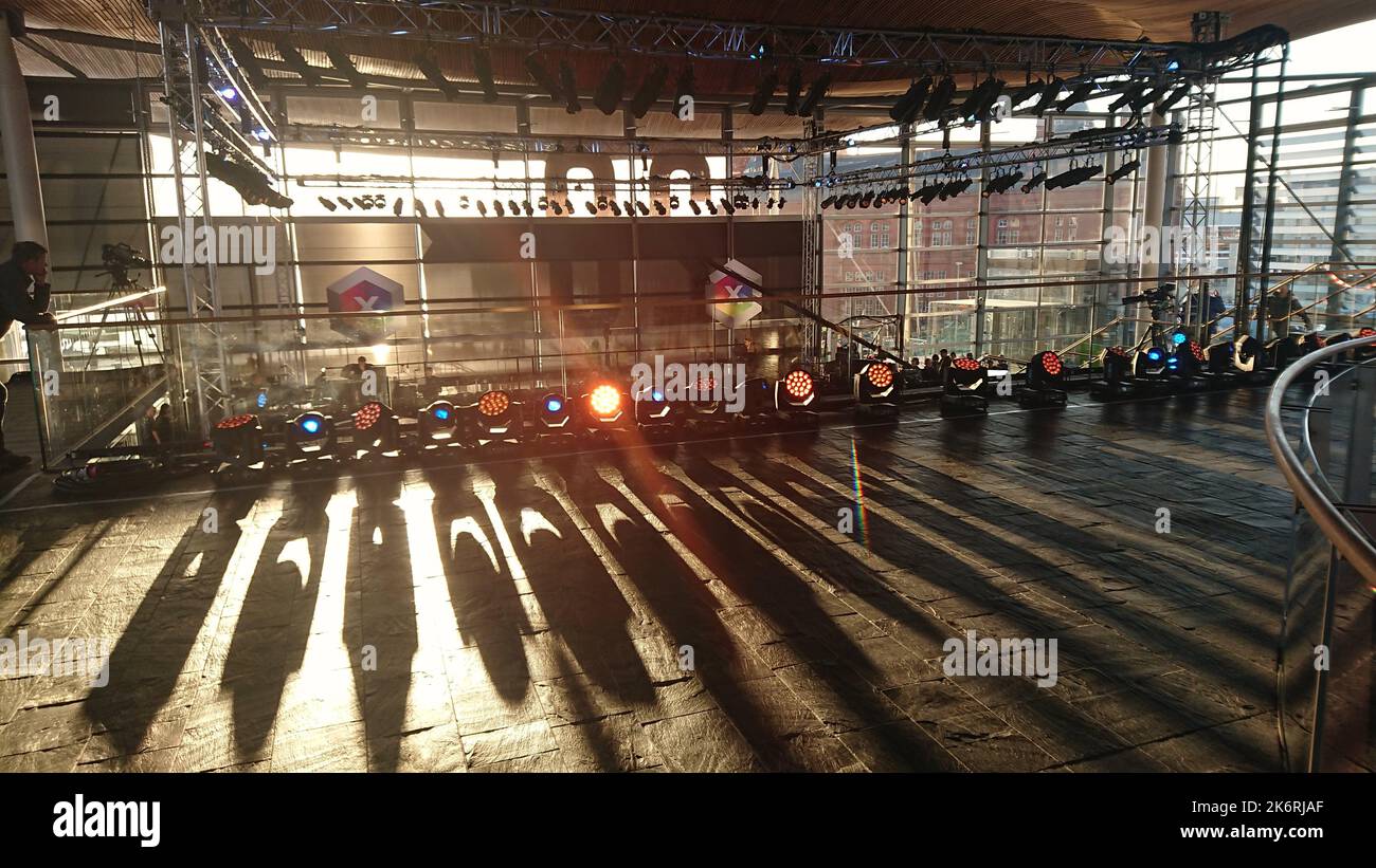 Lights in the Light - TV spotlights casting shadows in the early ...